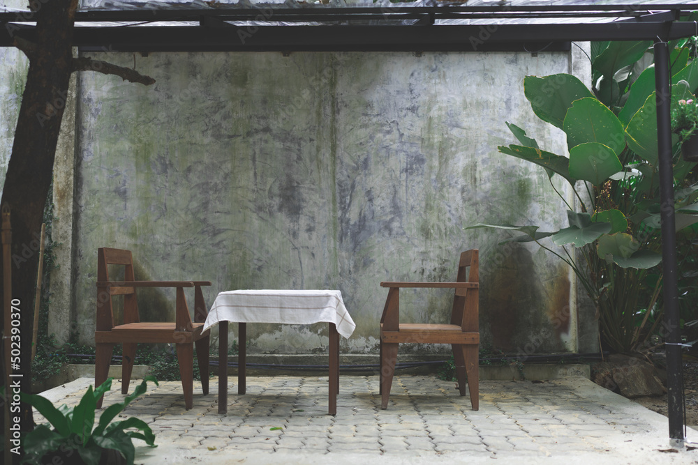 empty coffee cafe table with wood chair in green garden, wooden nature ...