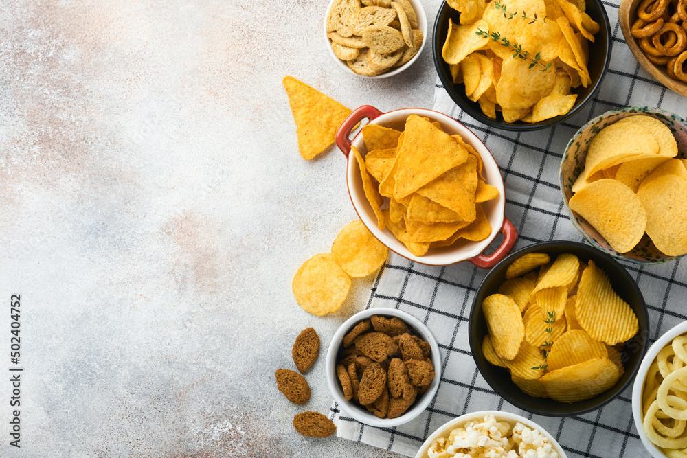 Snacks. Unhealthy food. All classic potato snacks with peanuts, popcorn ...