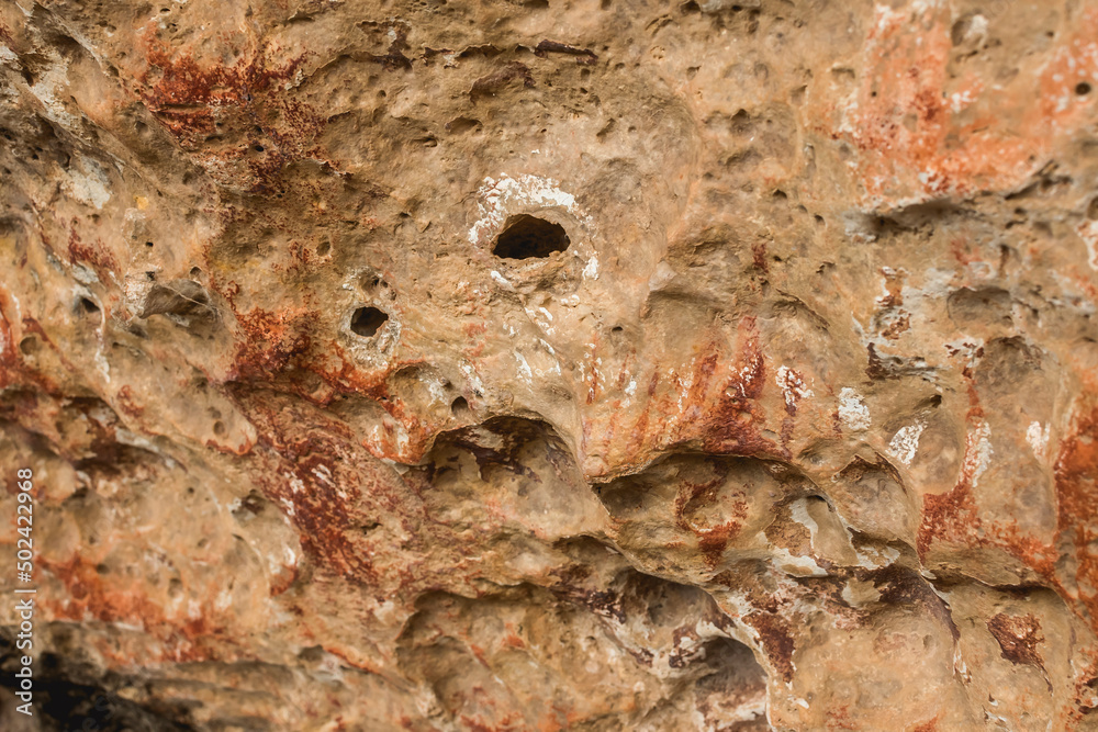 Stone Age hematite or red iron oxide hand prints color the limestone ...