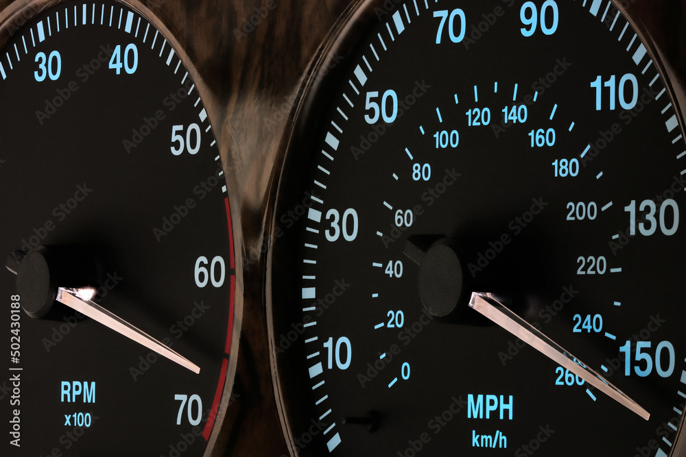 tachometer and speedometer in car dashboard at full power in ...