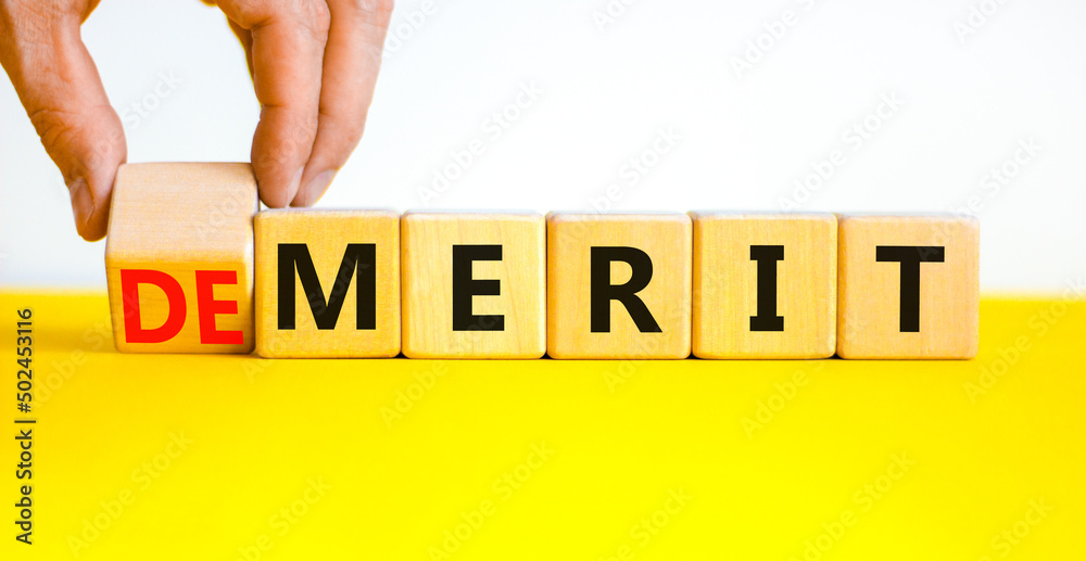 Demerit or merit symbol. Businessman turns wooden cubes and changes the ...