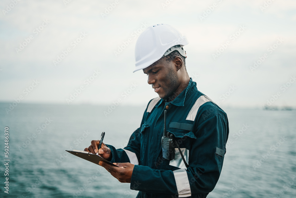 African American seaman filling checklist during work Stock Photo ...