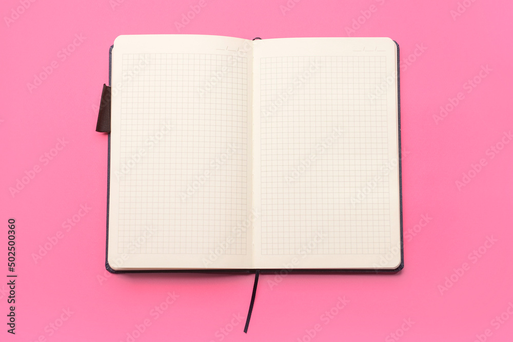 Blank open notebook on pink background Stock Photo | Adobe Stock