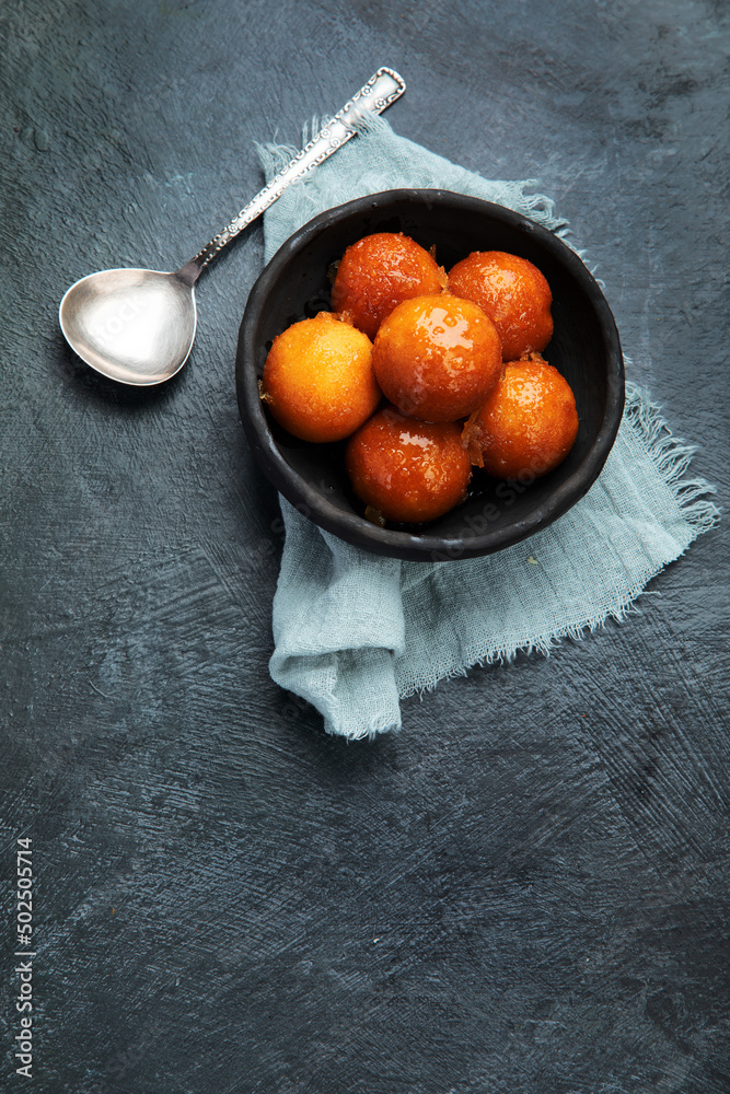 Gulab Jamun on gray background. Stock Photo | Adobe Stock