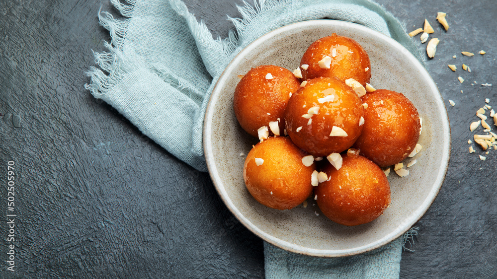 Gulab Jamun on gray background. Stock Photo | Adobe Stock