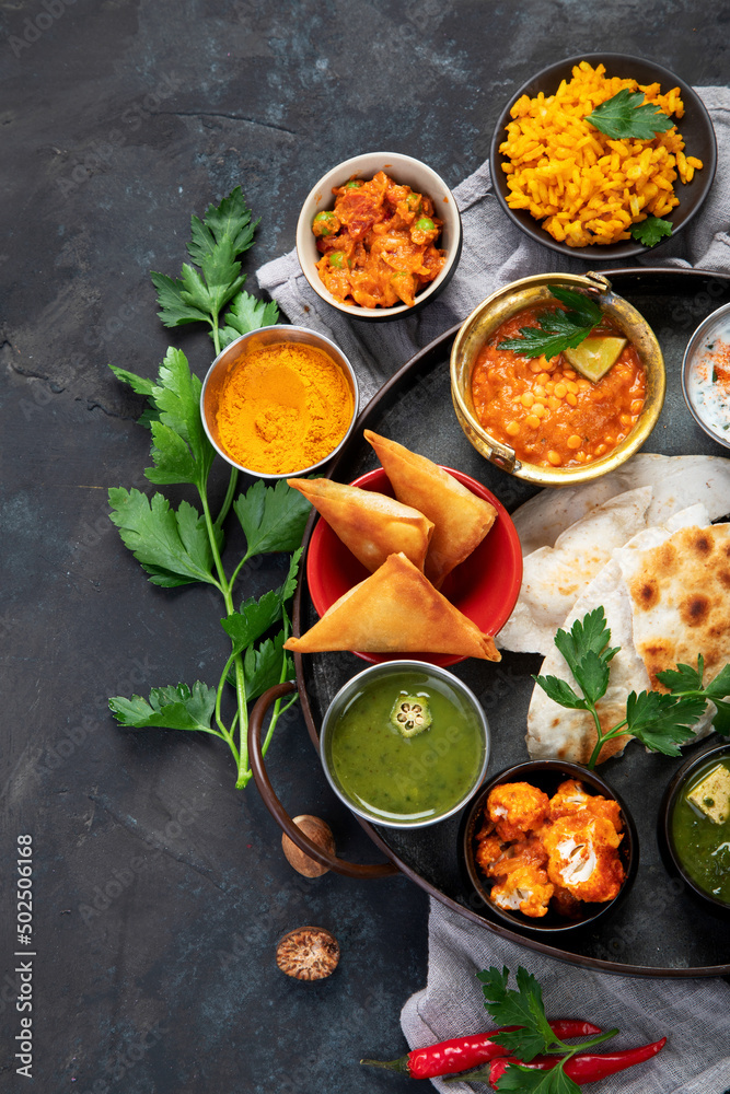 Indian Thali on dark background. Stock Photo | Adobe Stock