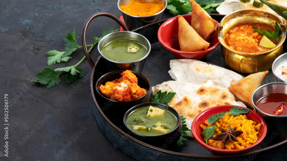 Indian Thali on dark background. Stock Photo | Adobe Stock