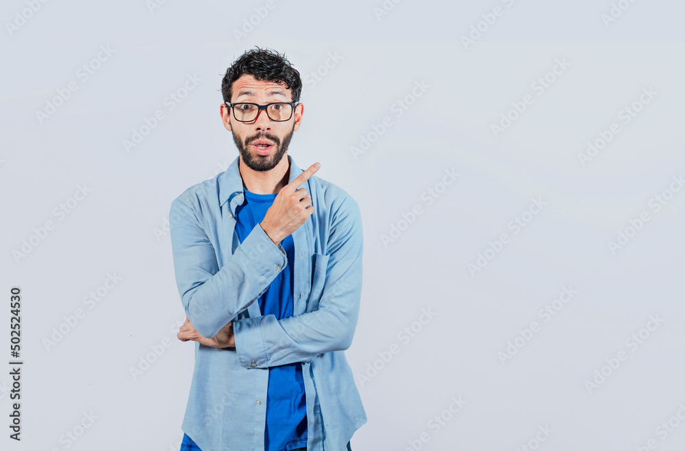 Surprised man pointing to a banner to the side, shocked guy pointing ...