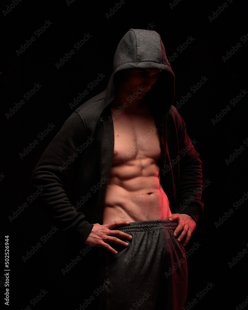 Caucasian Muscular Sun Tanned Man On Dark Background Fashion Portrait