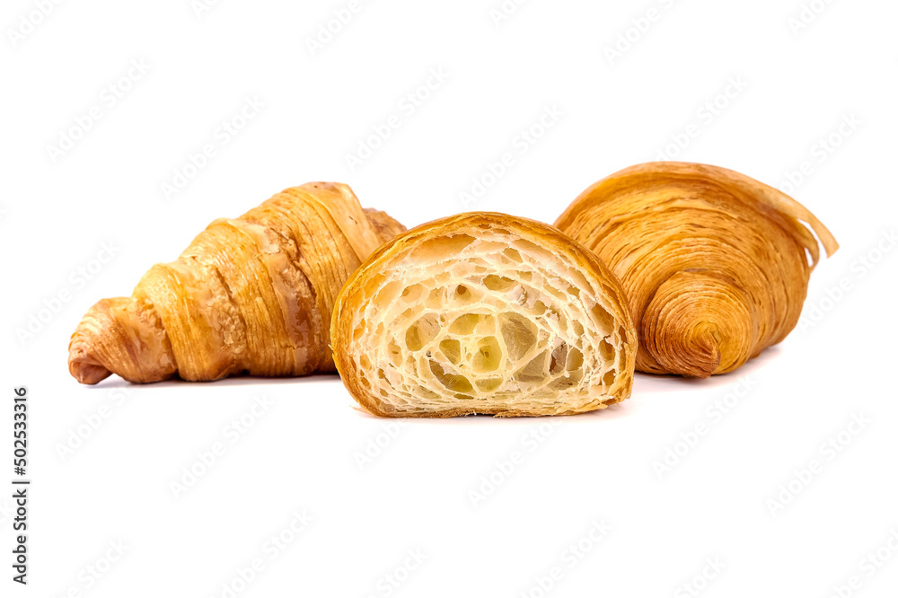 Plain Croissants and cut in half, showing the cross section, a classic ...