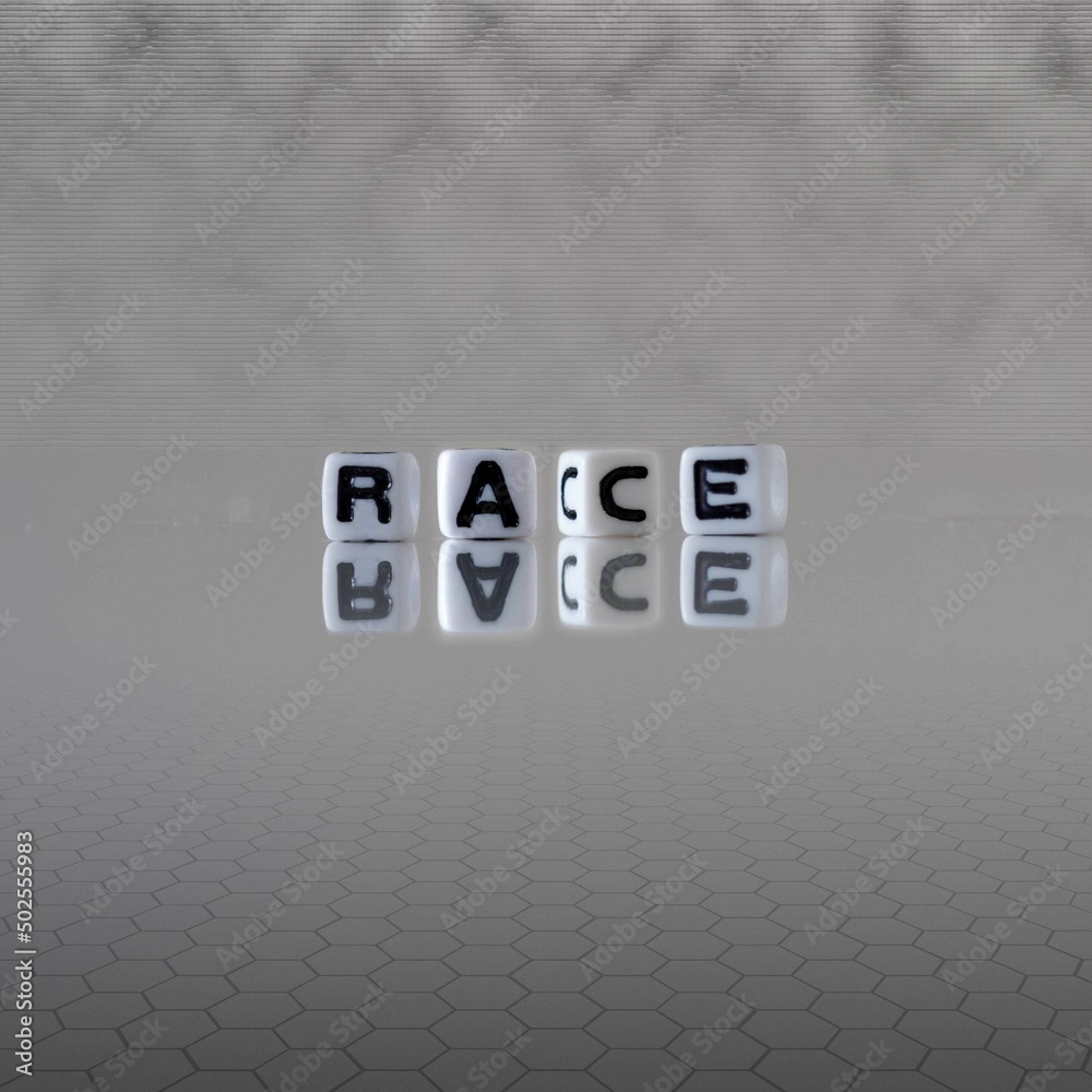 race word or concept represented by black and white letter cubes on a ...