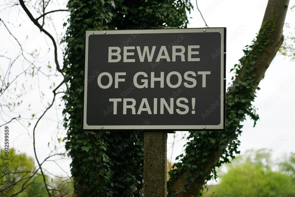 beware of ghost train sign Stock Photo | Adobe Stock