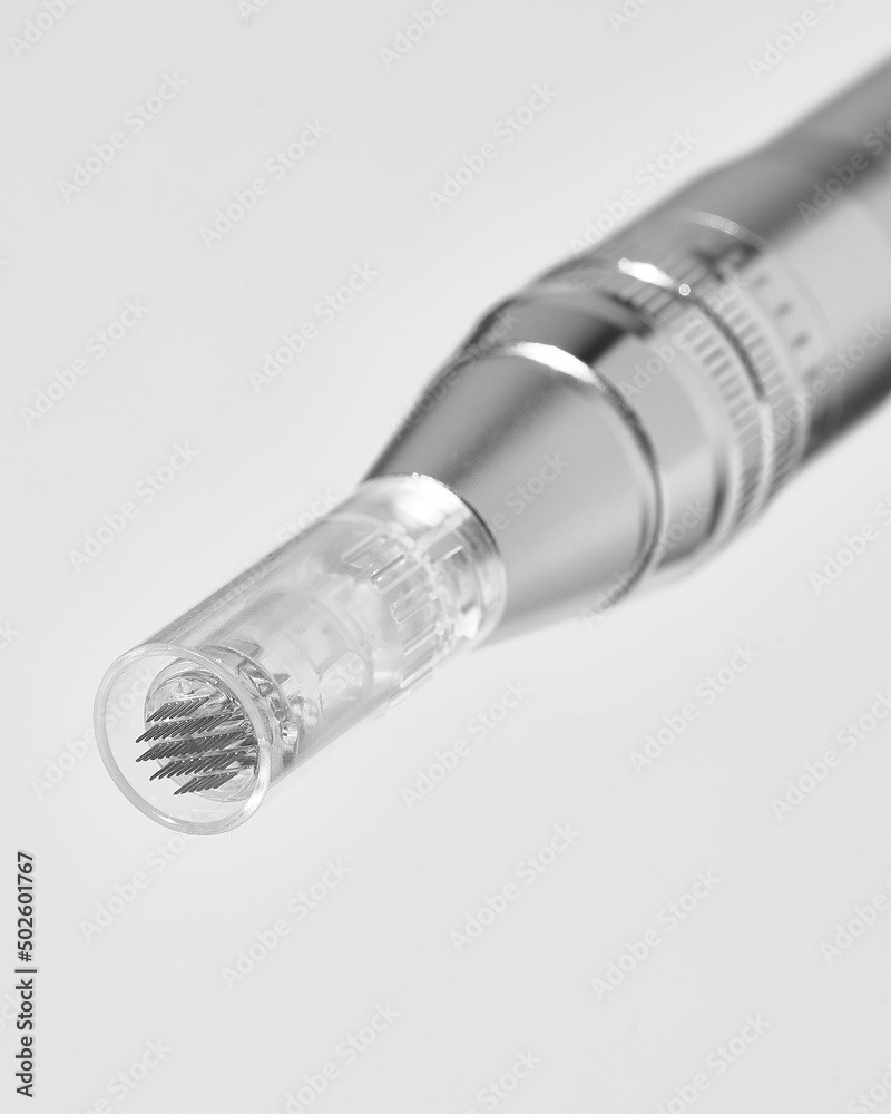 Dermis stamp electric pen. Dermapen. Needle mesotherapy treatment close ...