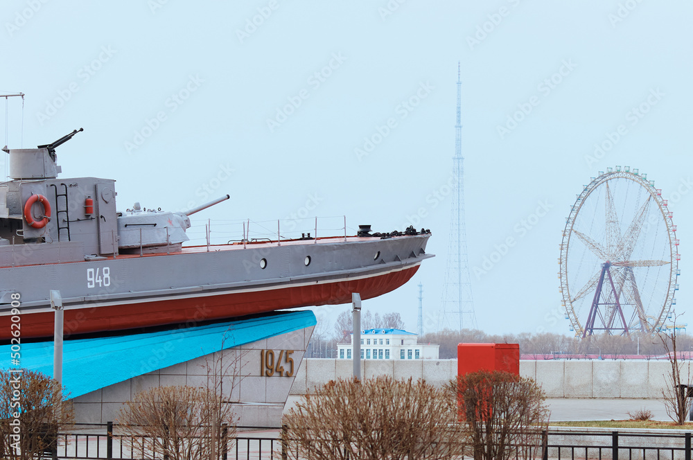 Small torpedo boat on the pedestal of the Amur river embankment ...