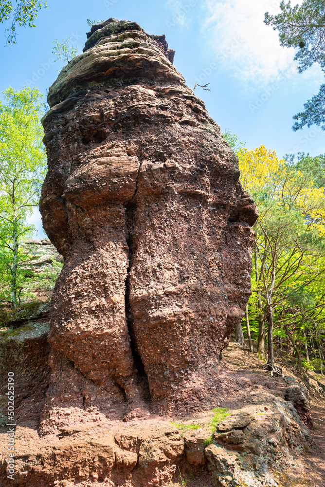 Huge lone rock, used for rock climbing, also known as "via ferrata" or ...