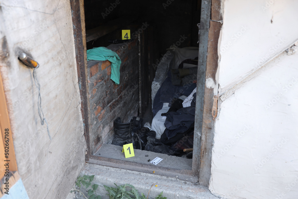 Evidence with yellow CSI marker for evidence numbering on the ...