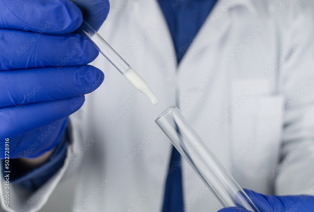 Medical laboratory assistant checks a test tube with sperm. Spermogram ...