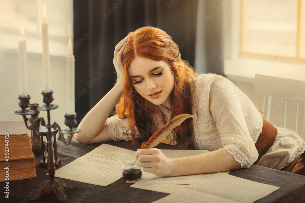 Medieval red-haired woman writer holds pen feather quill in hands, sits ...
