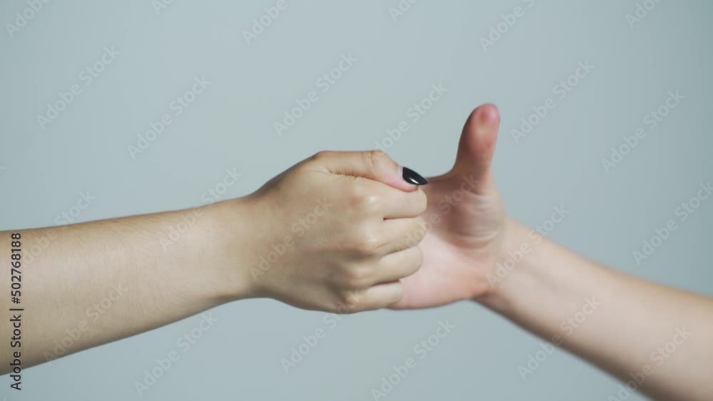 Human arm and thumb wrestling. Woman and man hands playing thumb wars ...