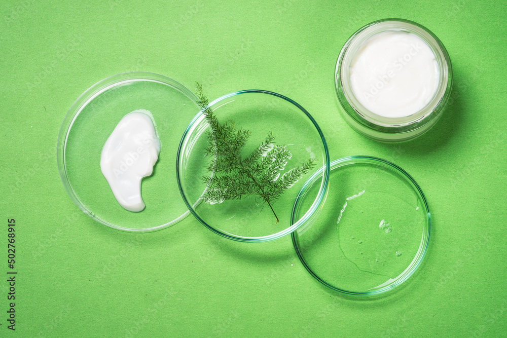 Cosmetic laboratory concept with natural ingredients. Glass petri dish ...