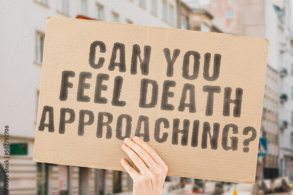 The question " Can you feel death approaching? " is on a banner in men ...