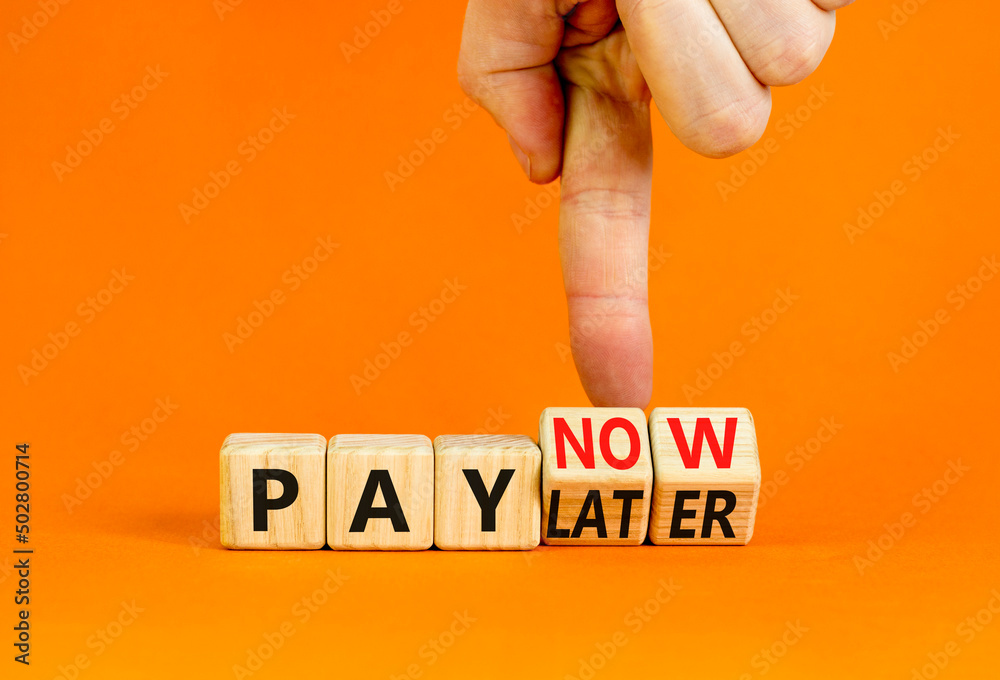 Pay later or now symbol. Businessman turns wooden cubes and changes ...