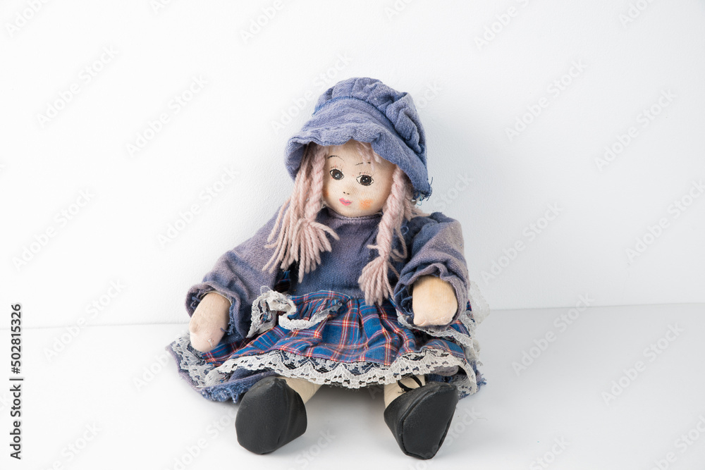 Old vintage rag doll in a dress. Stock Photo | Adobe Stock