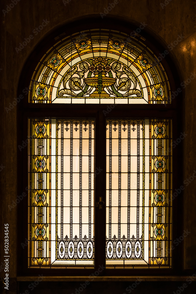 Bright and colorful stained glass window from inside building in Europe ...