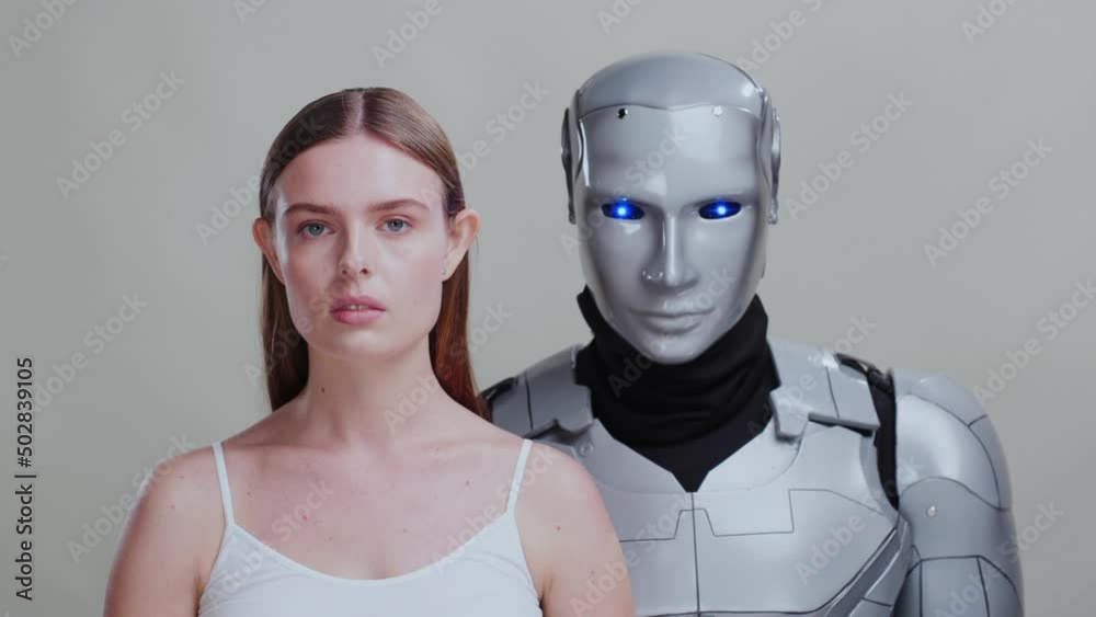 Portrait couple of young caucasian woman and robotic cyborg with blue ...