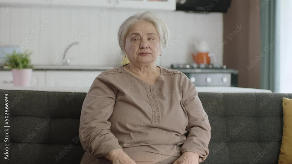Peaceful old woman resting in her quiet home.Lonely old woman sitting ...