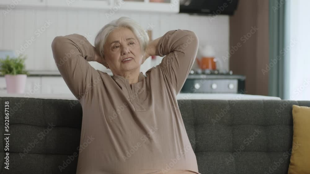 Peaceful old woman resting in her quiet home.Takes a break at home at ...