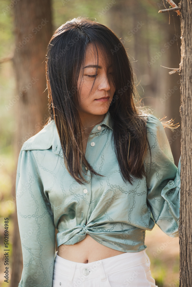 Beautiful Asian girl portrait with trees Stock Photo | Adobe Stock