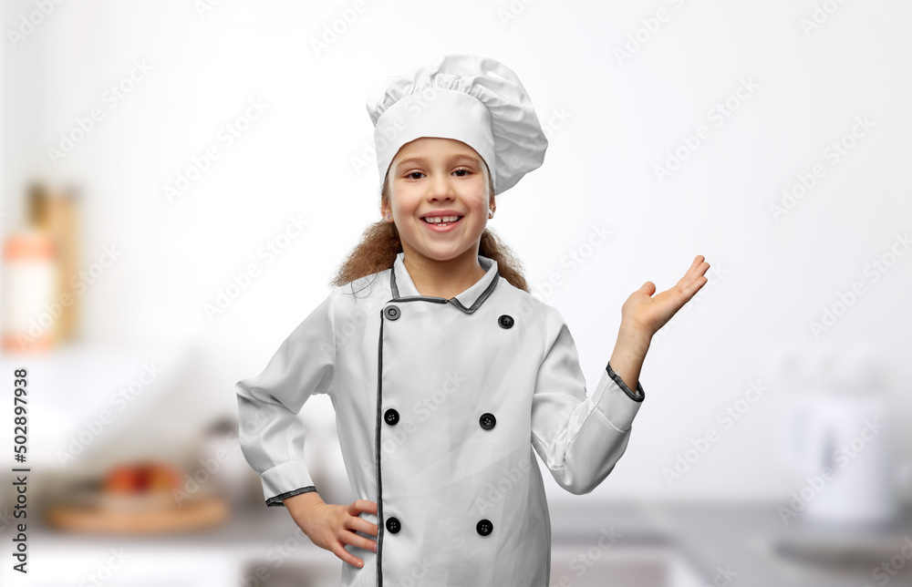 cooking, culinary and profession concept - happy smiling little girl in ...