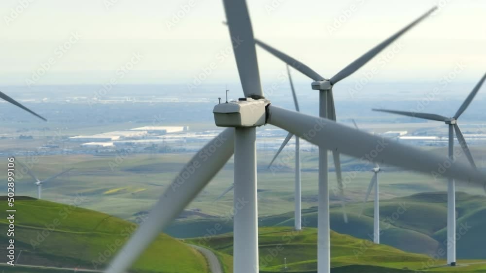 Close up view windmills turbines rotating and generating electric power ...