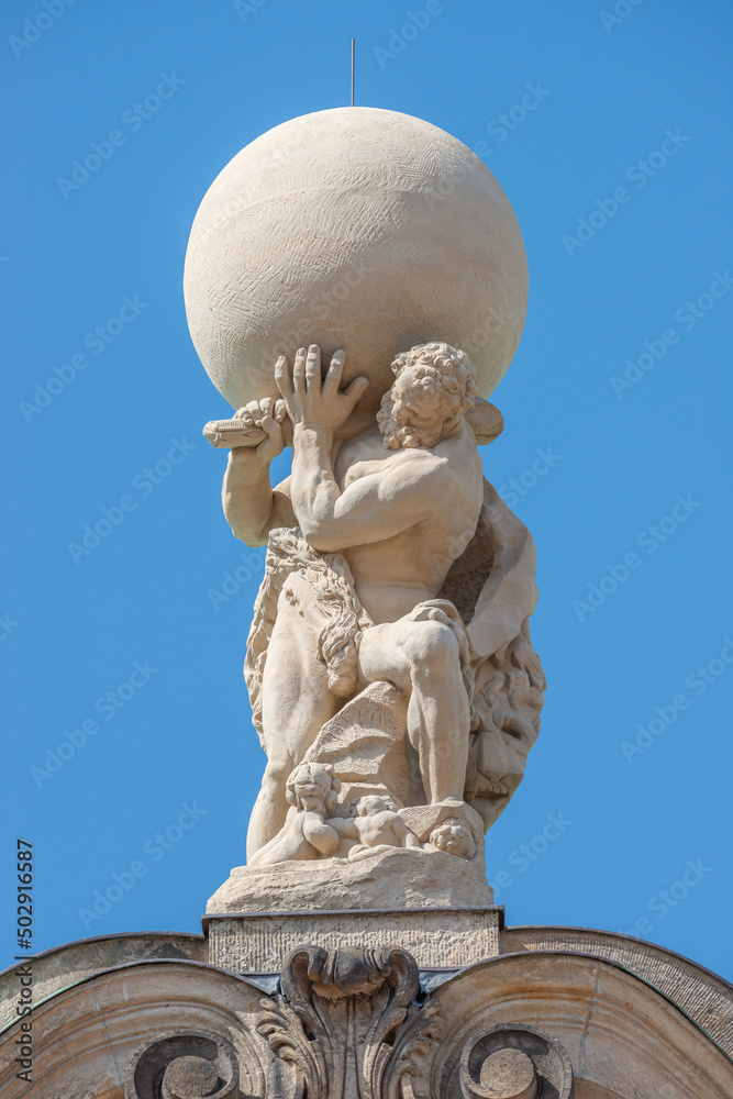 Old statue of powerful Heracles aka Atlas of Renaissance Era holding a ...