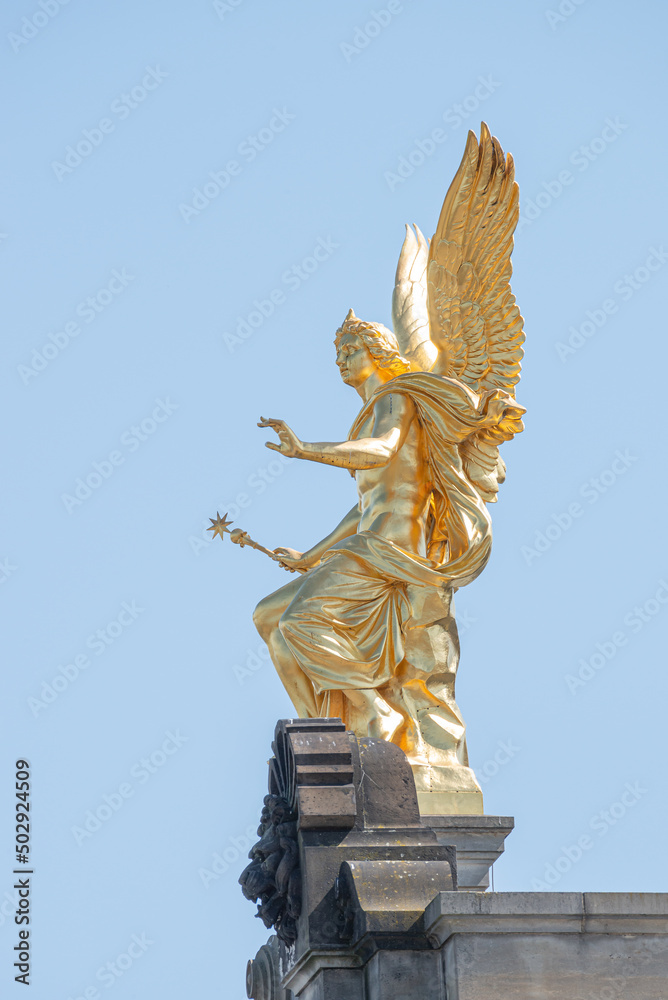 Old statue of a golden angel as a warrior and defender at the dome top ...