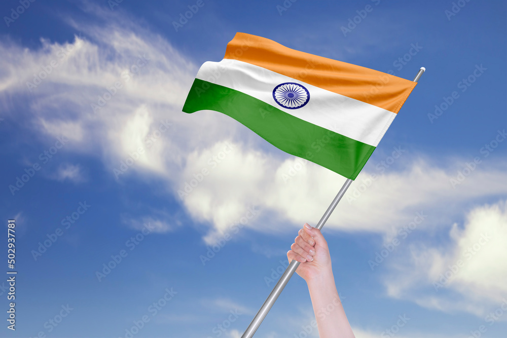 Female Hand is Waving Indian Flag Against Blue Sky with Clouds Stock ...