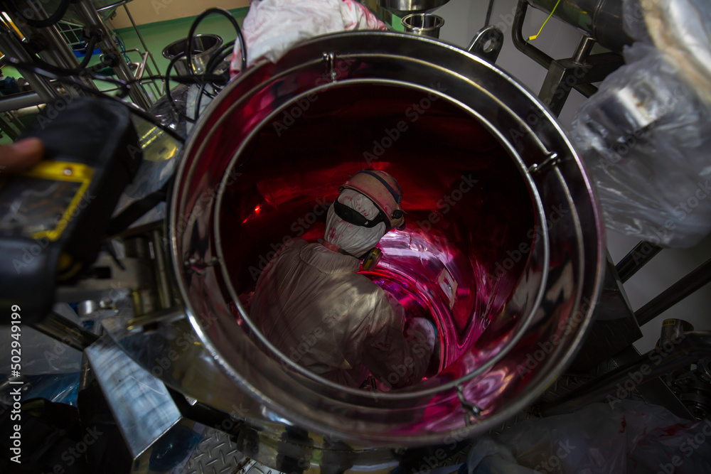 Worker hand holding gas detector inspection safety gas testing at front ...