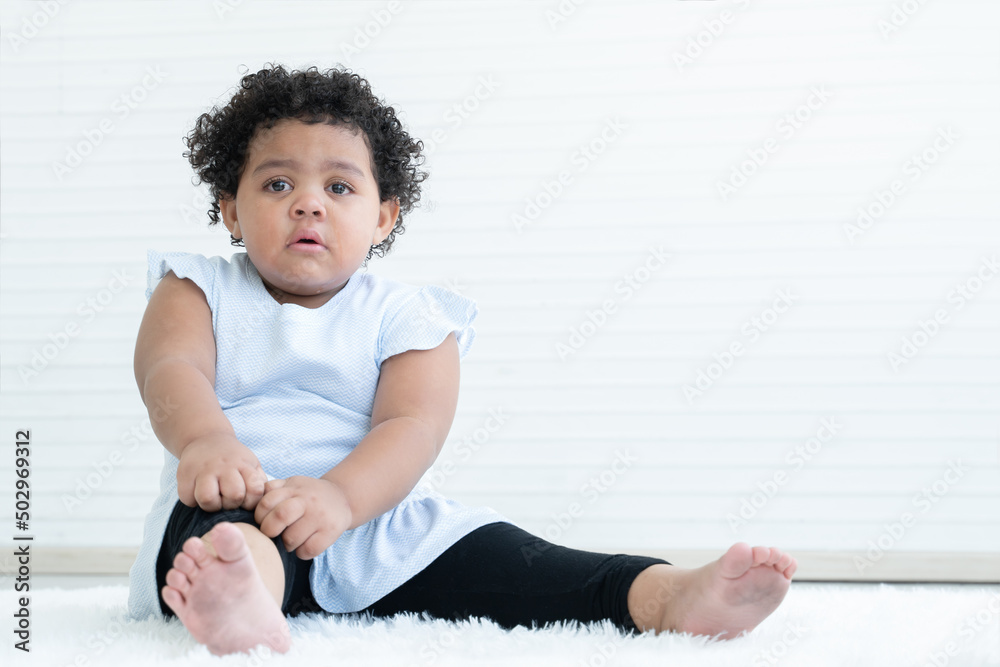 Little pitiful African American chubby kid girl is crying with tears ...