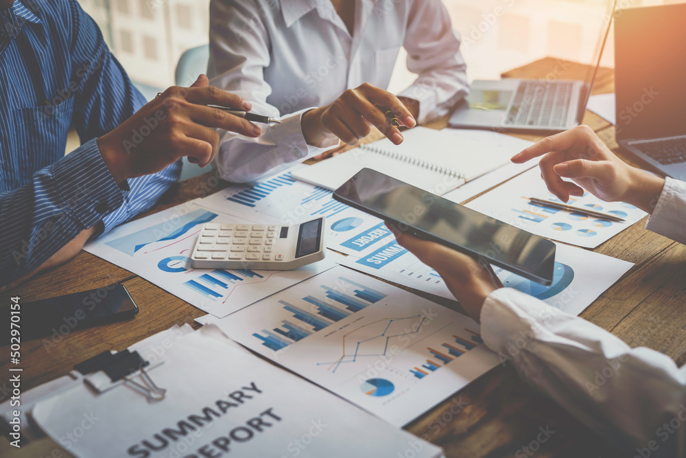 Business team finance or bookkeeper working with a calculator to ...