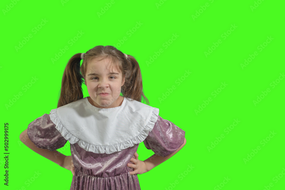 Harmful bad girl. Green screen. disgruntled little girl wearing retro ...