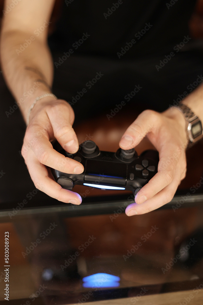 Playing games concept. Part body man with joystick play game on console ...