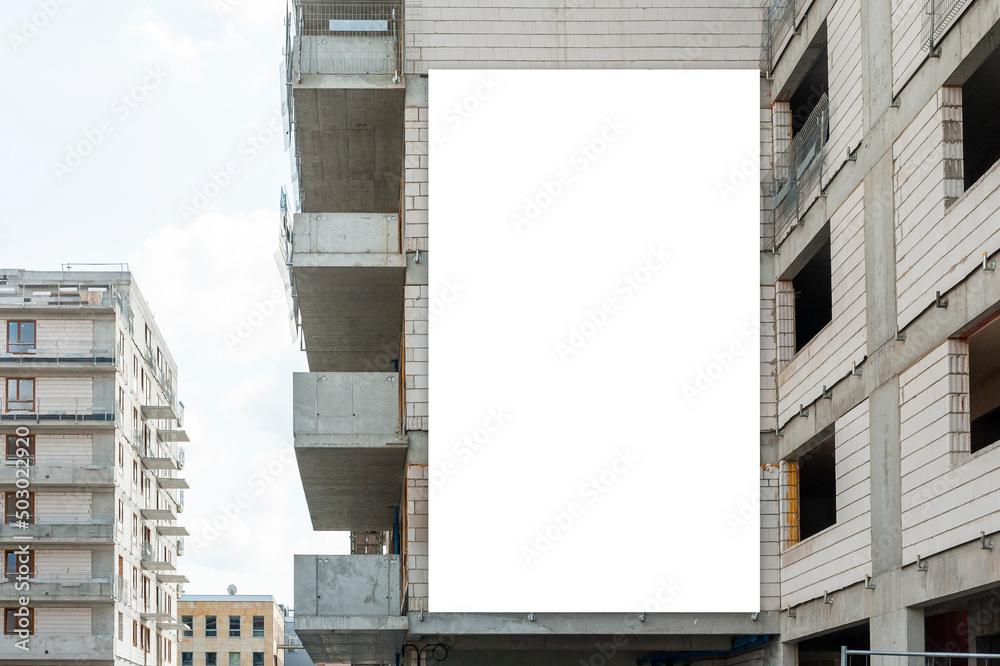 Blank white banner for advertisement on the wall of building under ...