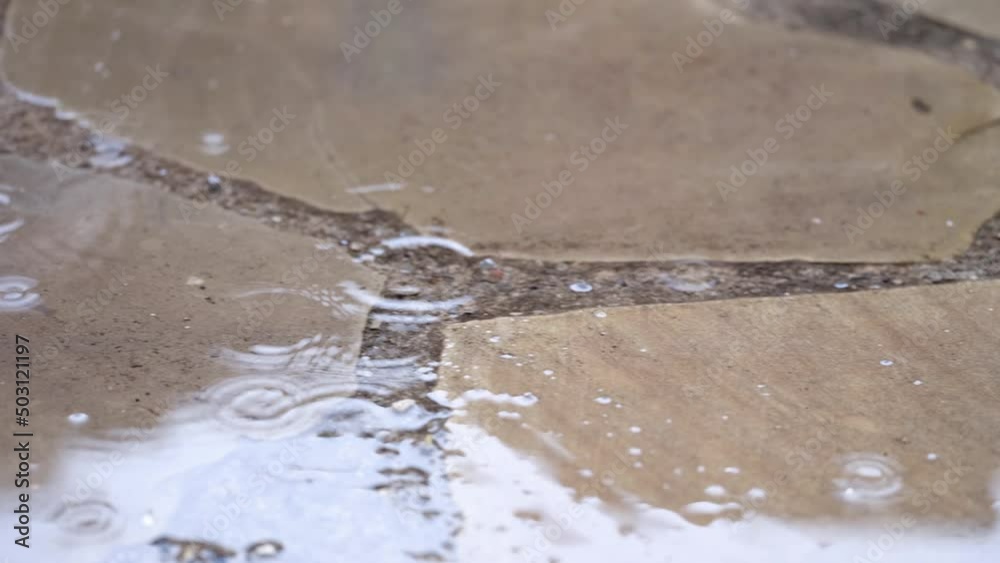 Rainy rain on stone pavers as background texture for urban design Stock ...