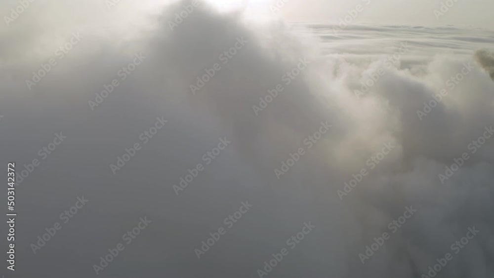 White, dense and thick smoke column, highly polluting from a fire ...
