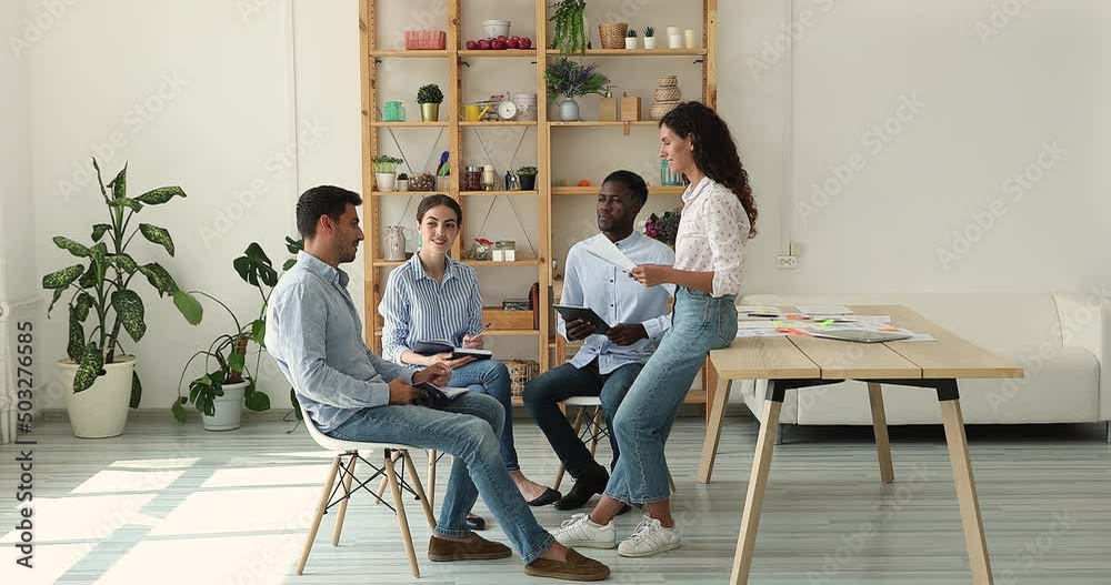 Young Hispanic female team leader coach involve diverse multinational ...