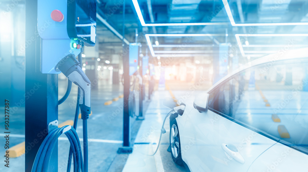 Car charging at electric car charging station. Electric vehicle charger ...