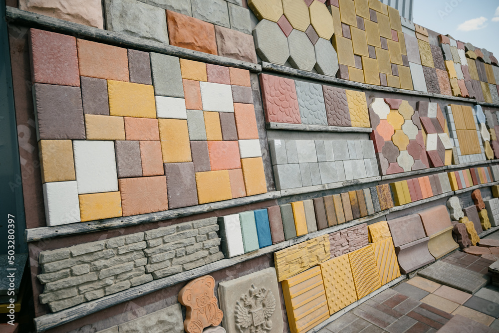 Paving slabs of different colors and shapes.Decorative cobblestones are ...