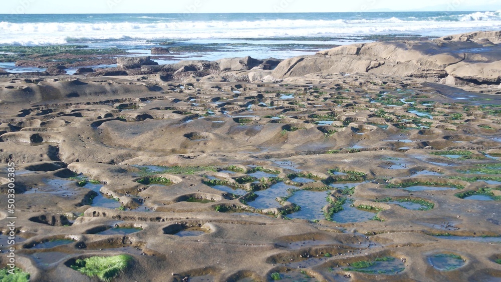 Eroded rock formation, tide pool in La Jolla, California coast, USA ...