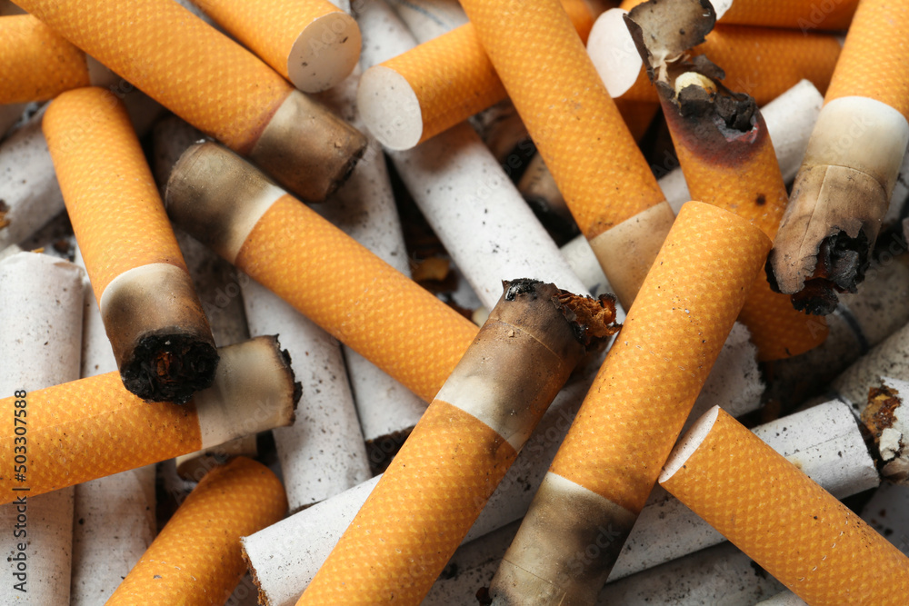 Pile of cigarette stubs as background, closeup view Stock Photo | Adobe ...